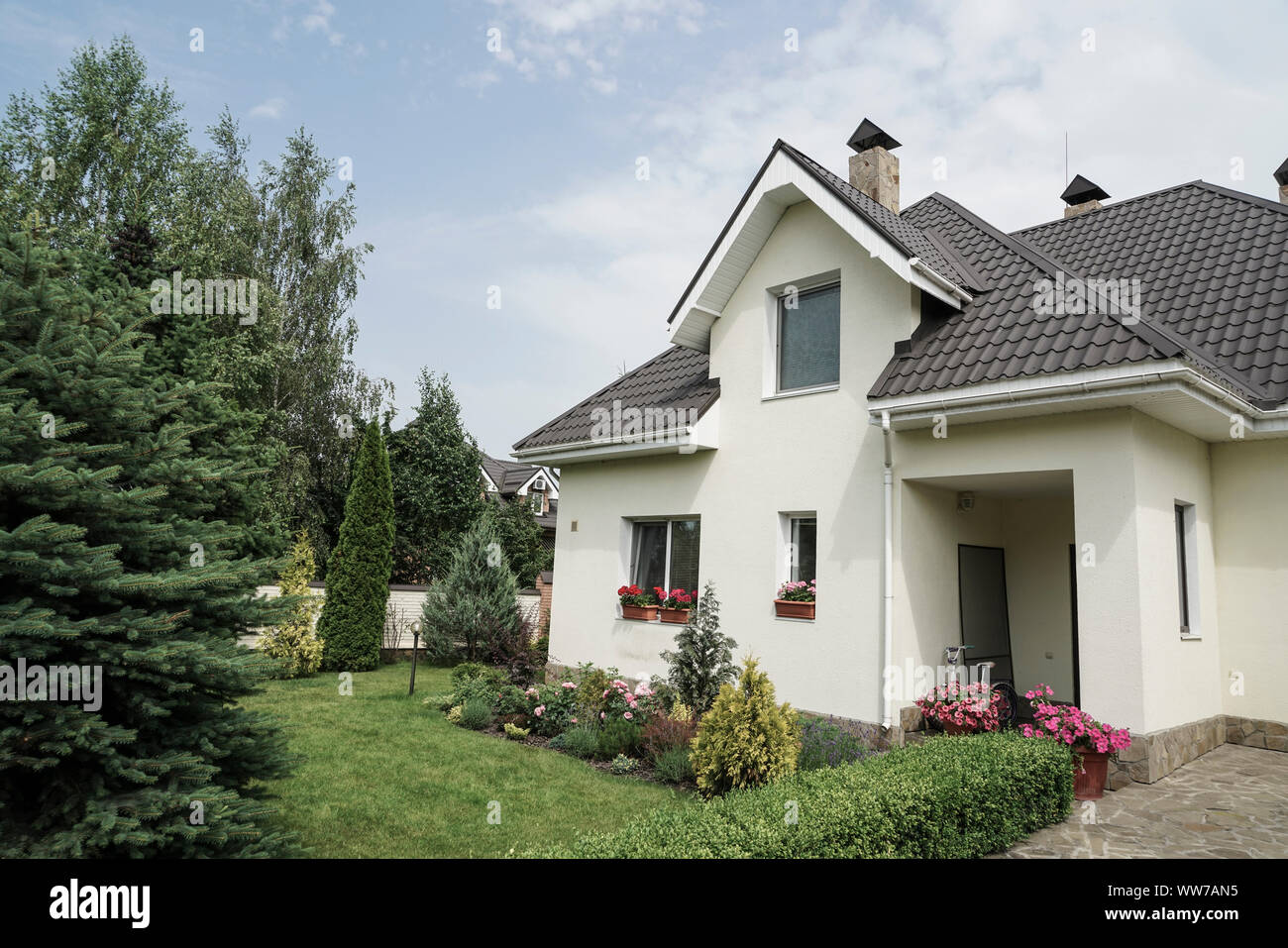 A new house with a garden in a rural area under beautiful sky Stock ...