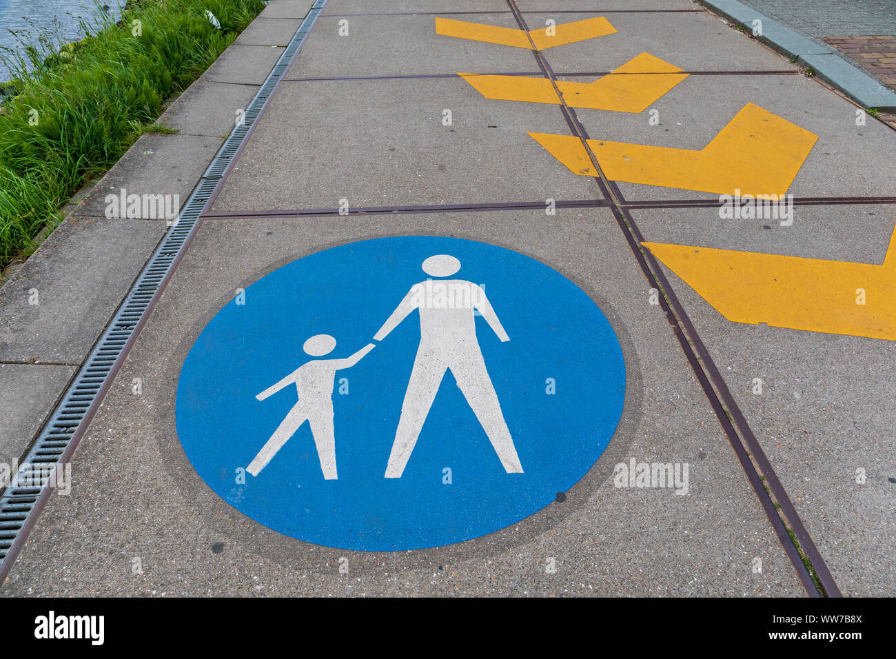 Big Blue Sign for Pedestrian Lane at Pavement Stock Photo - Alamy