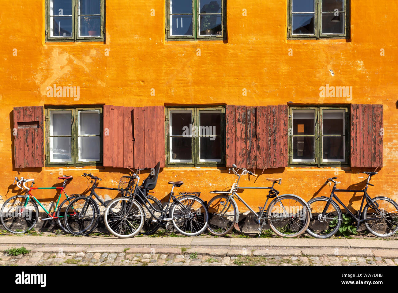 Historic row yellow houses in Nyboder neighborhood in Copenhagen, a ...