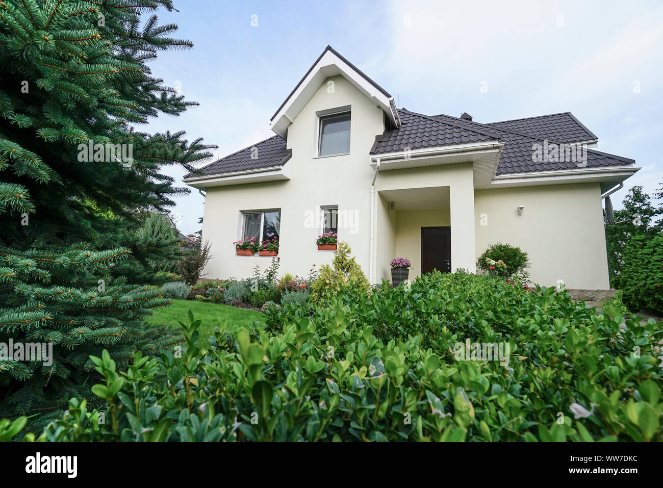 A private house and its garden in a rural area Stock Photo - Alamy