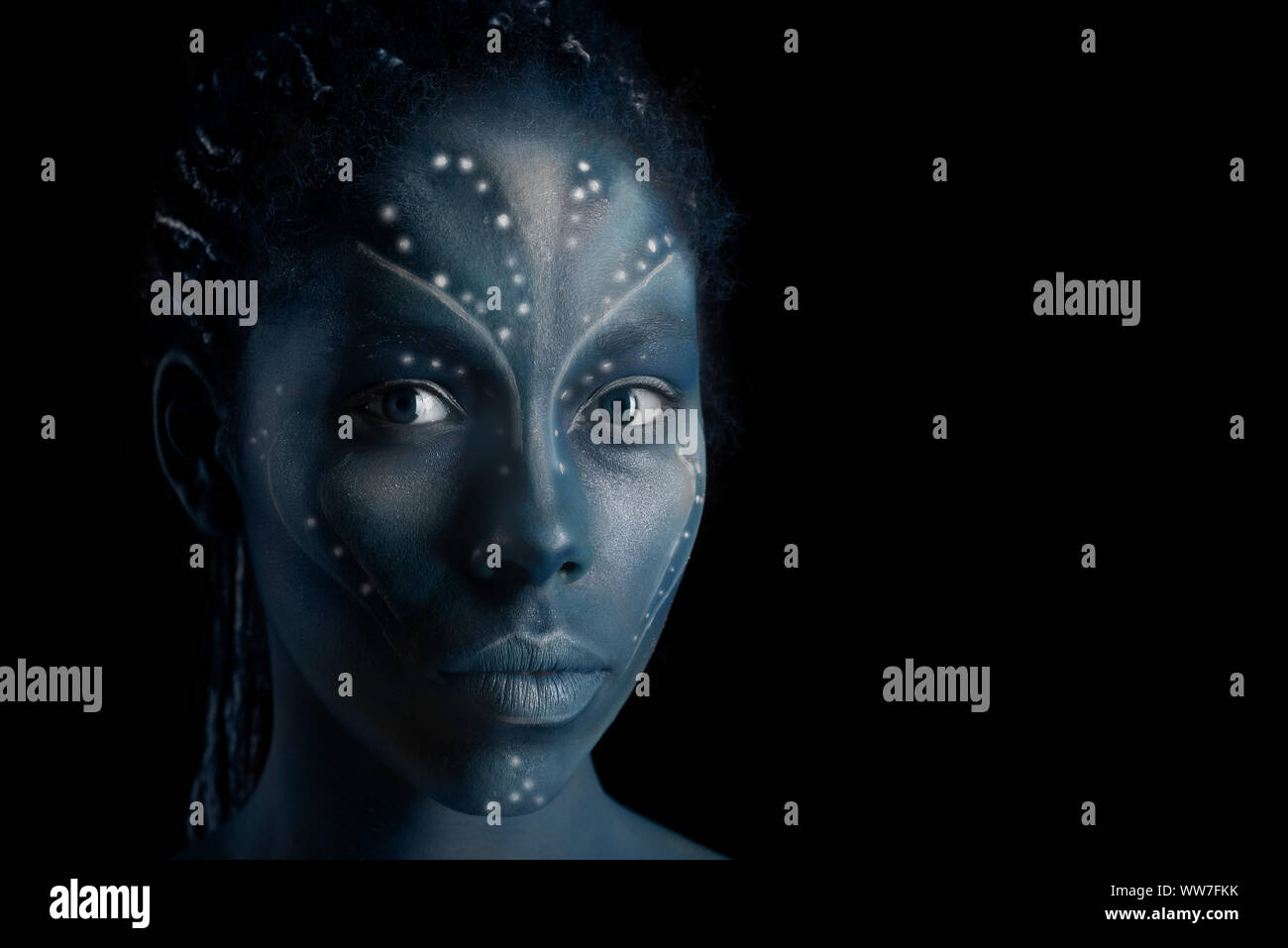 Portrait of beautiful African girl with blue tribal paintings ...