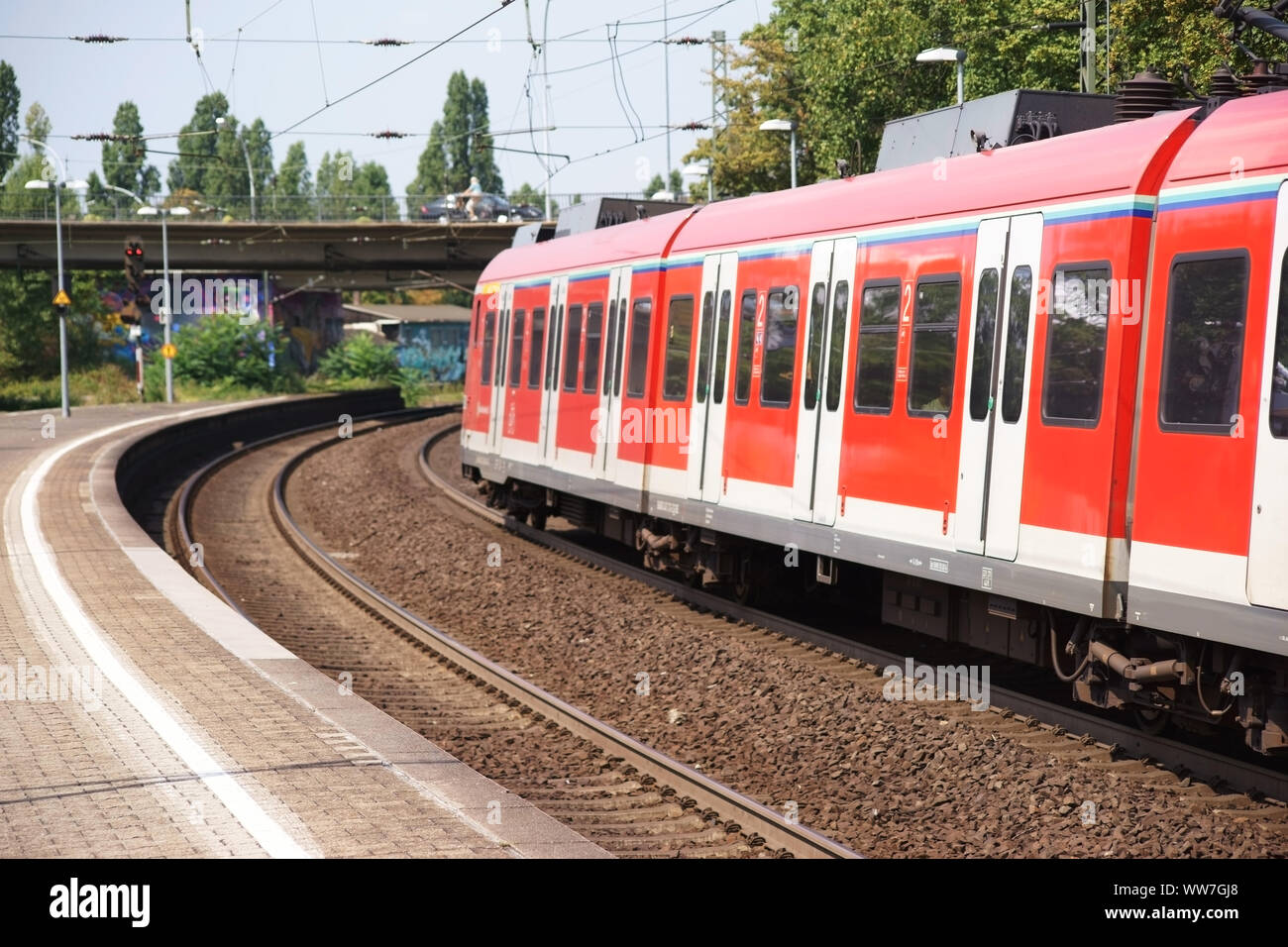 The curve of platform with passing train local train hi-res stock ...