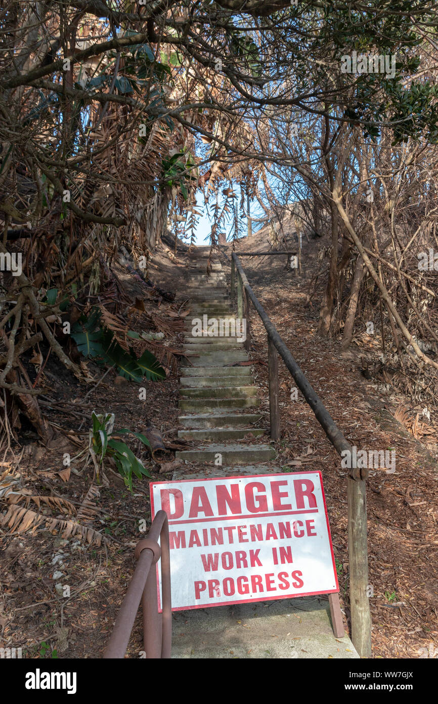 A close up view of a sign that says Danger, no entry zone due to ...