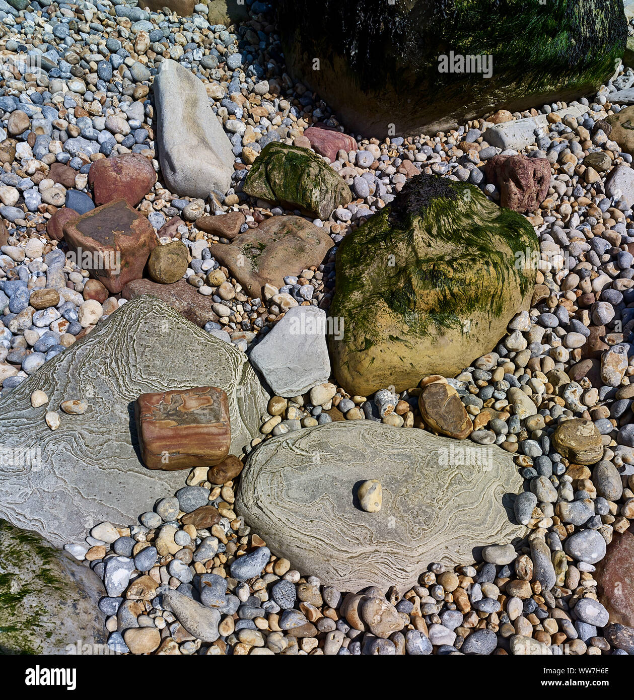 Beach abstract with pebbles and rocks on the south coast of England ...