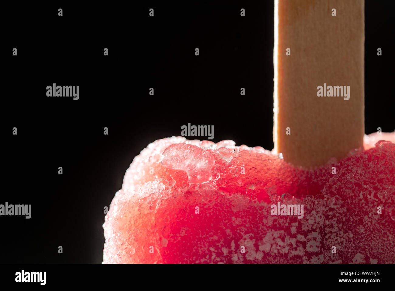 red popsicle with icesicles on a stick. Close up on Stock Photo - Alamy