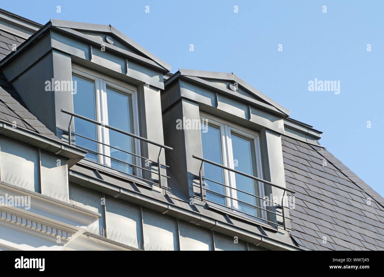 modern dormer pair on rooftop of old apartment house Stock Photo - Alamy
