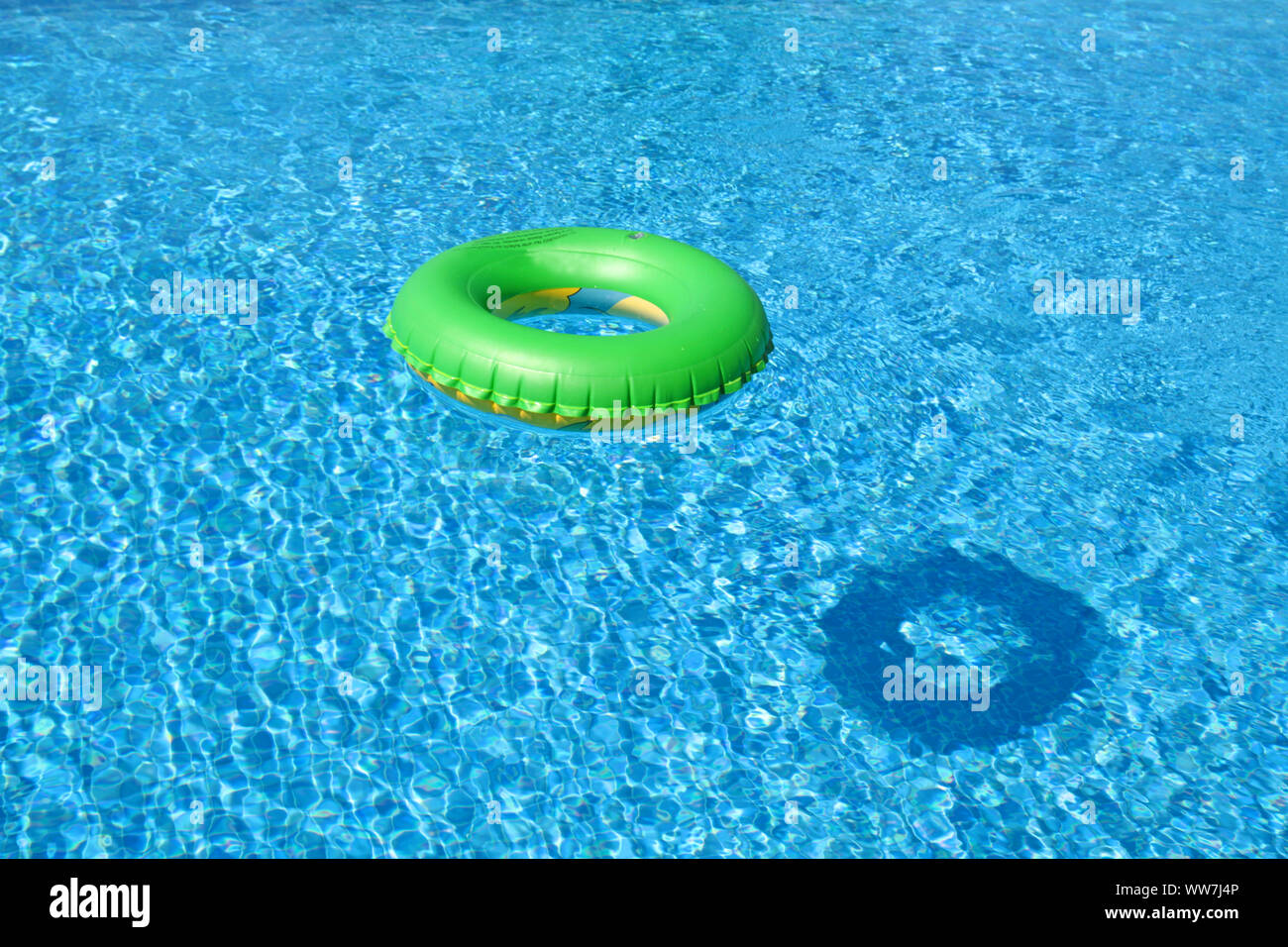 green floating tire in a pool Stock Photo - Alamy