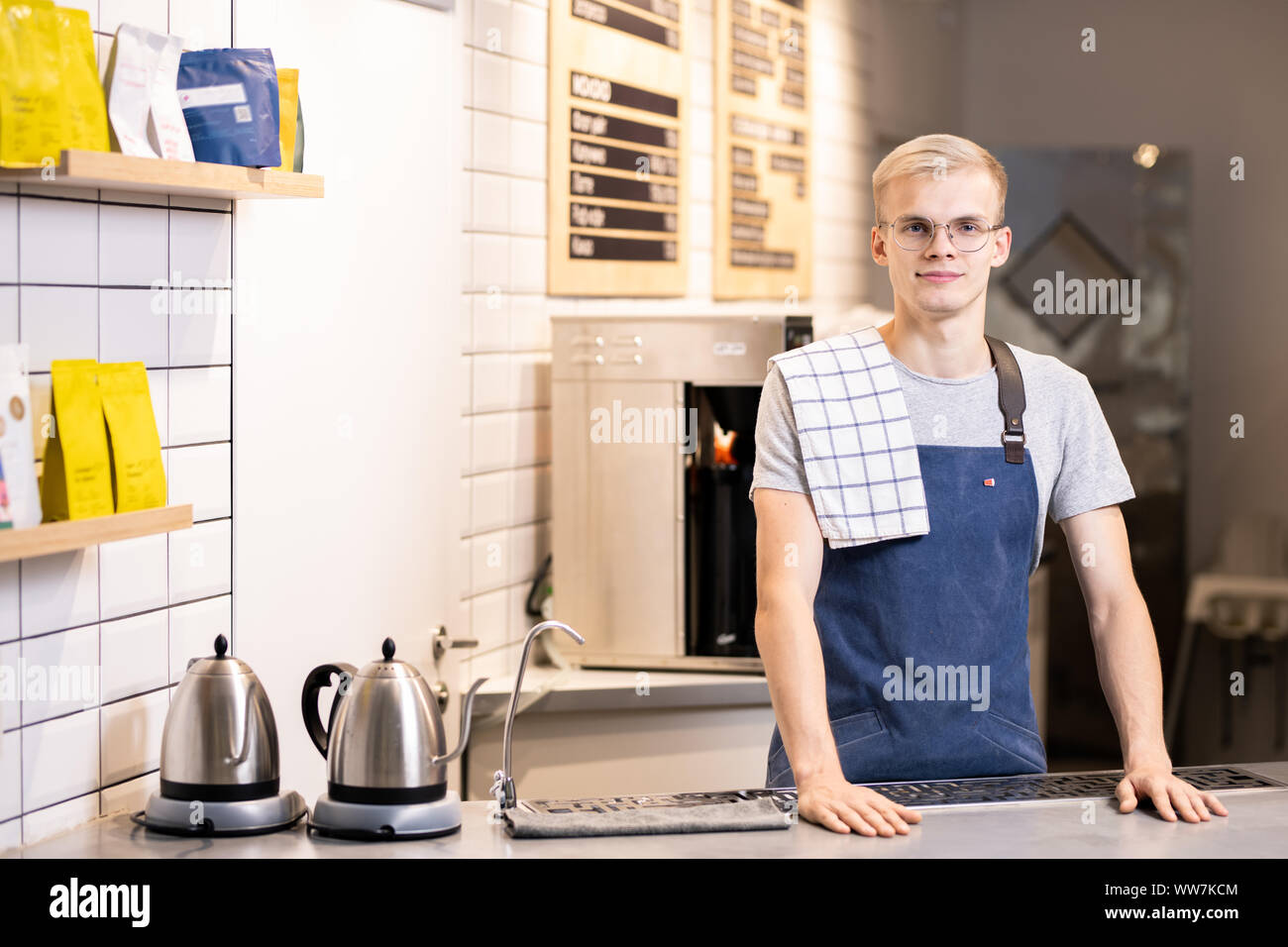 Smiling young barista in hi-res stock photography and images - Alamy