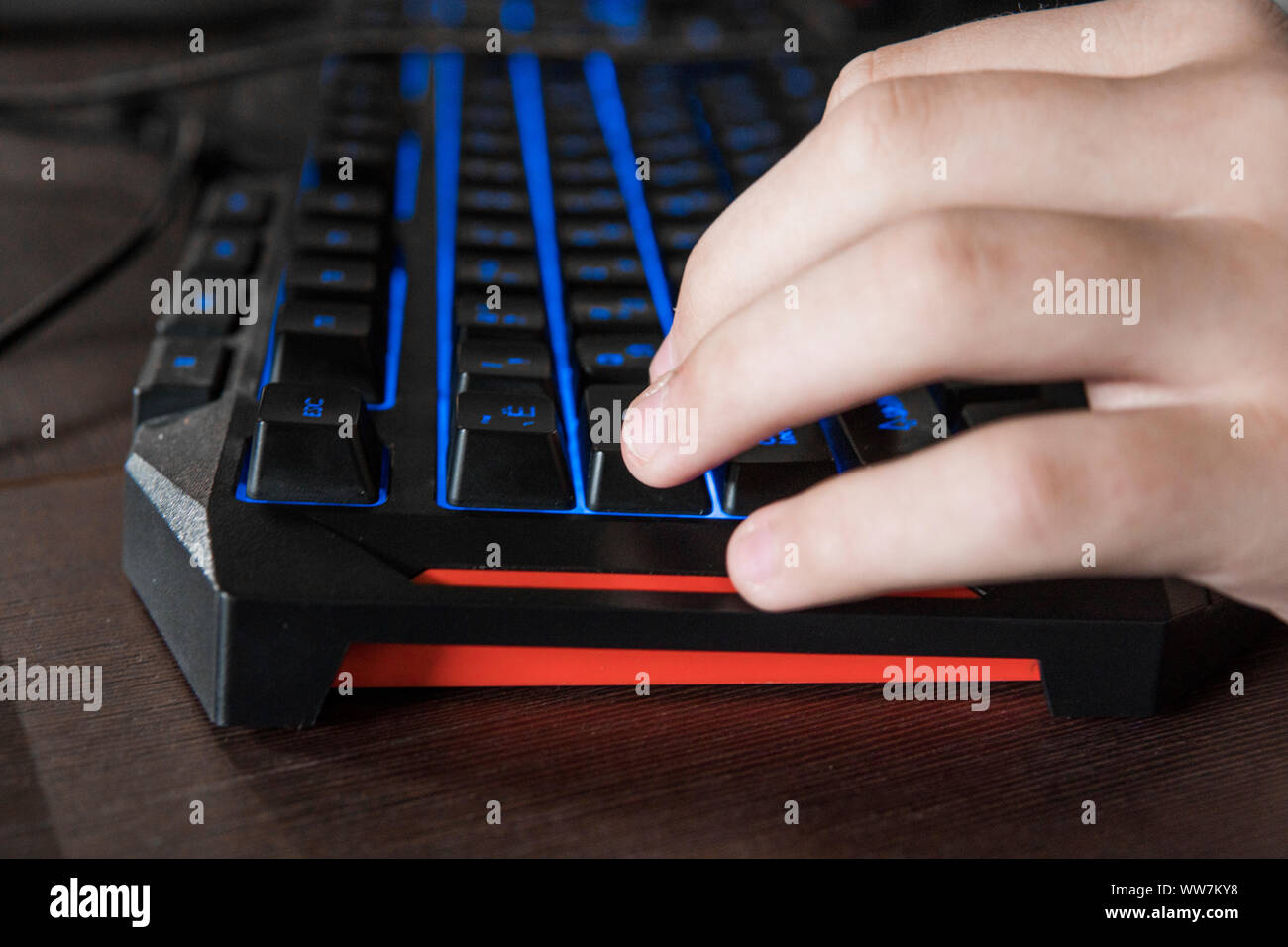 Gamer keyboard with colorful blue lights, modern gamer computer. Blue ...