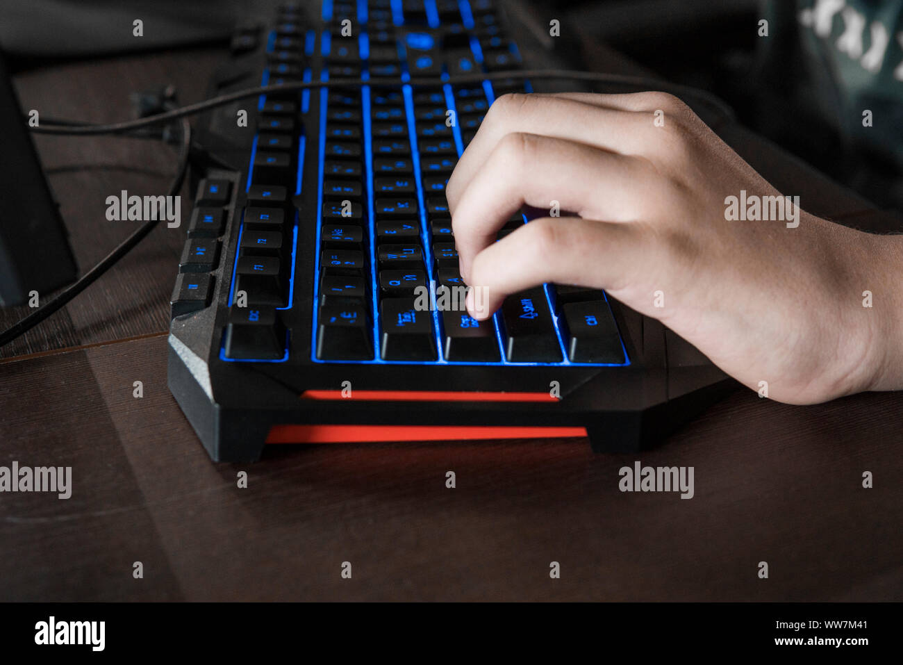 Gamer keyboard with colorful blue lights, modern gamer computer. Blue ...