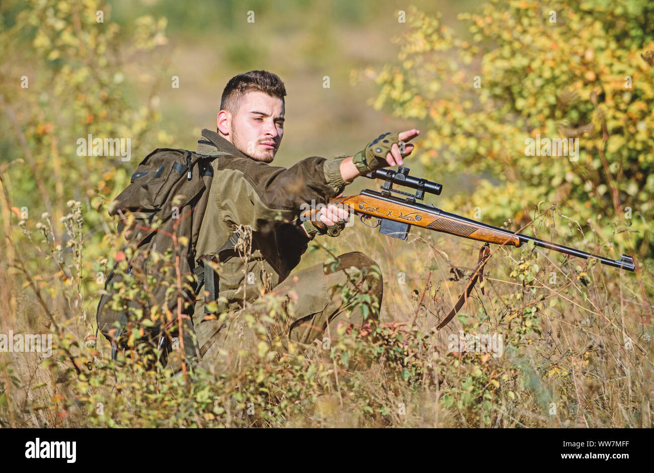 Hunter hold rifle. Hunting permit. Bearded serious hunter spend leisure hunting. Hunting ...