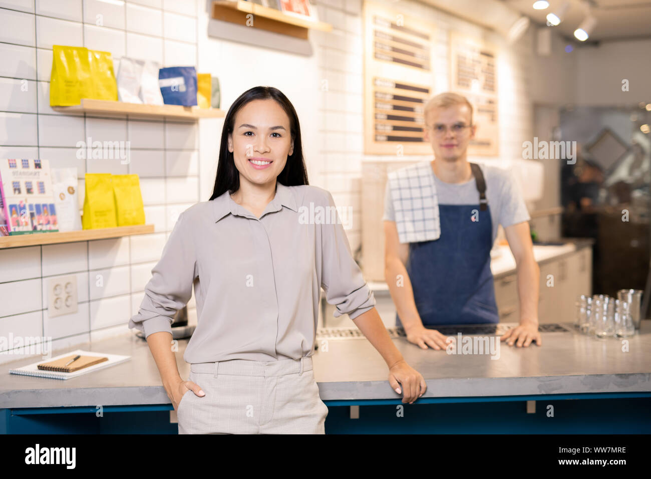Smiling manager standing in front hi-res stock photography and images ...