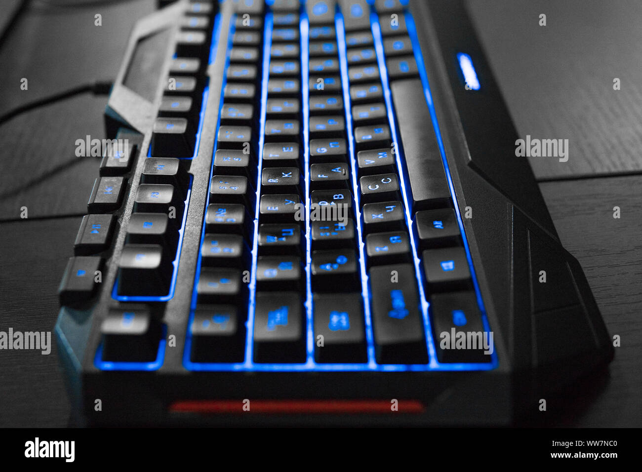 Gamer keyboard with colorful blue lights, modern gamer computer. Blue ...