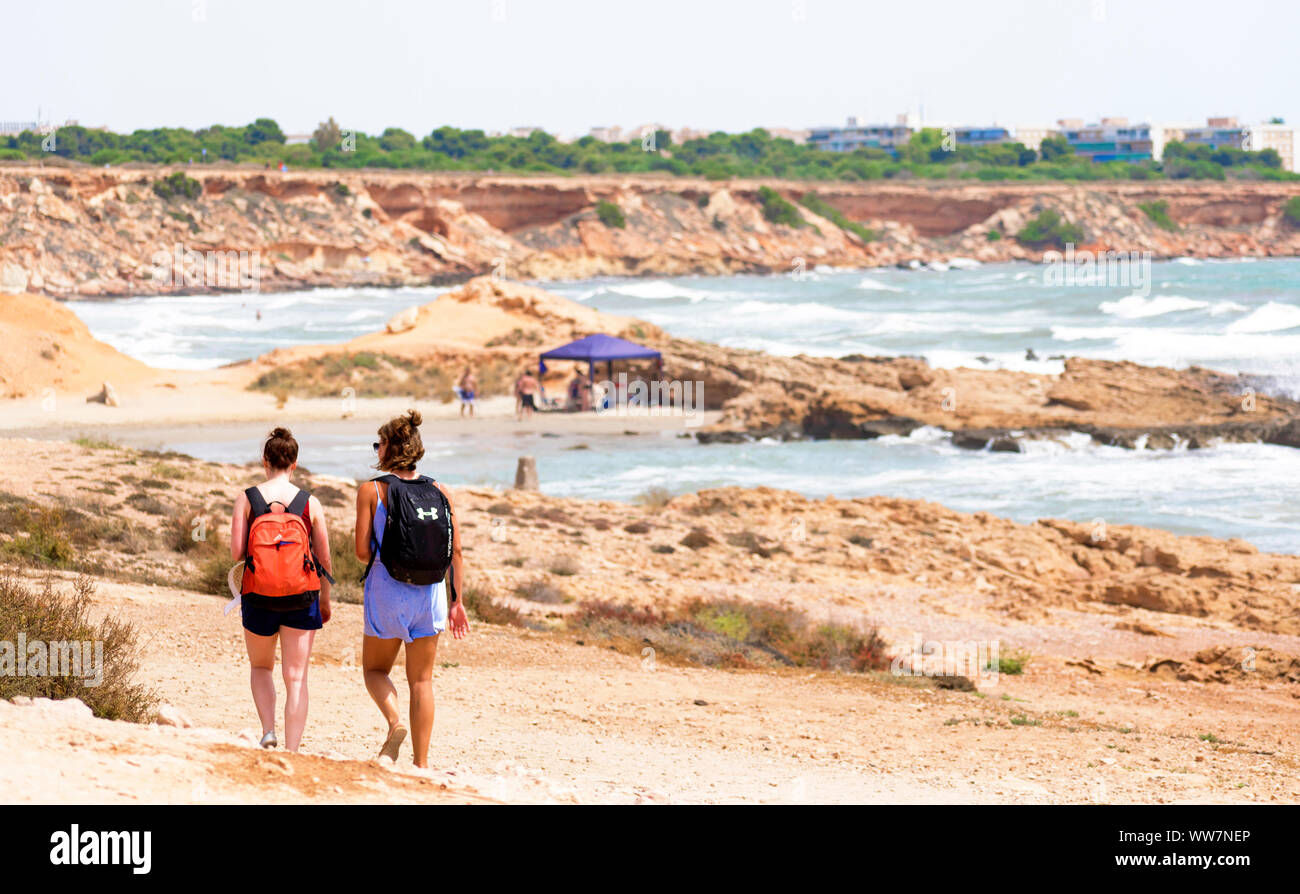 Alicante, Spain, August 20, 2019: Friends hanging out at beautiful ...
