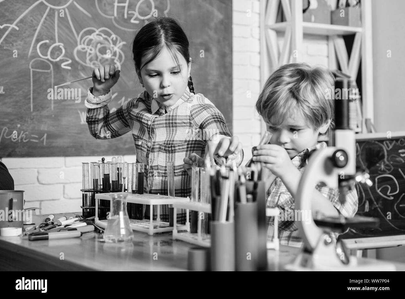 School club. Explaining chemistry to kid. Fascinating chemical reaction ...