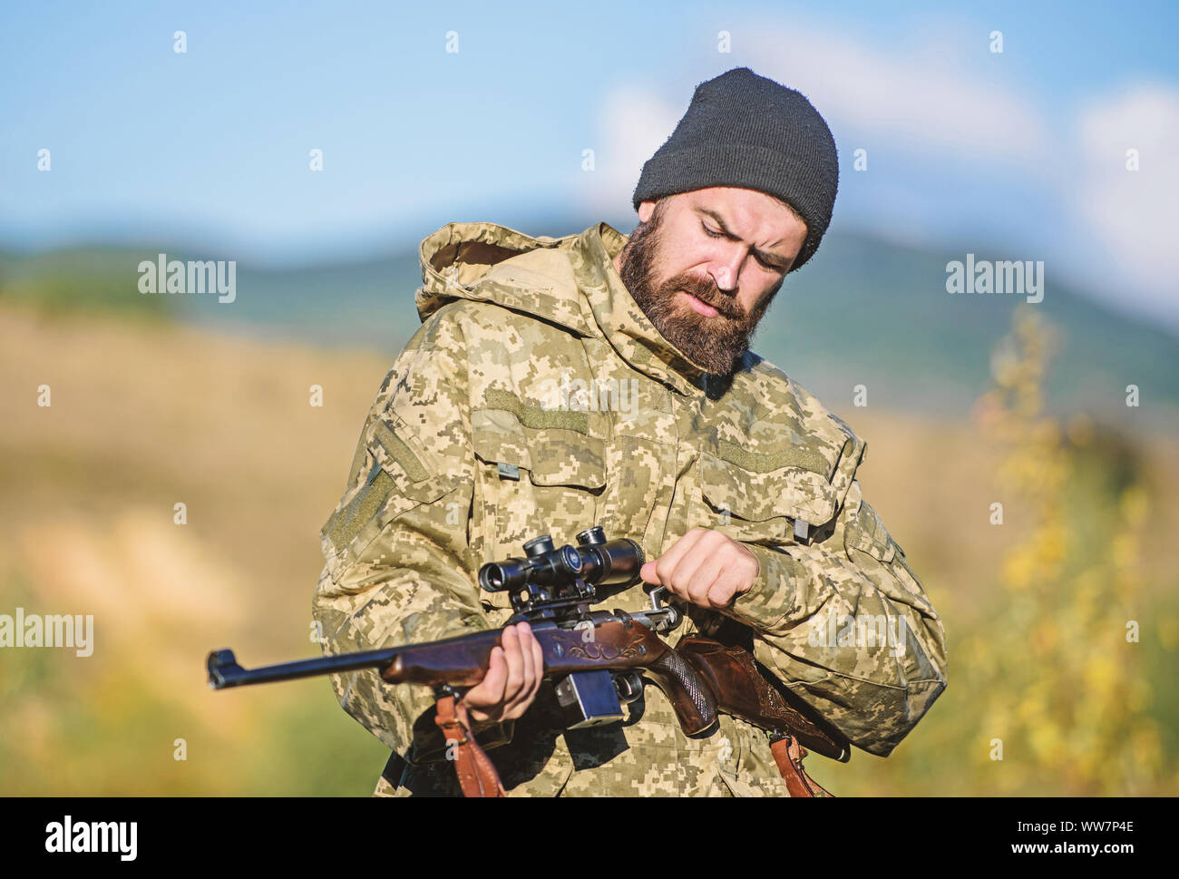 Focus and concentration of experienced hunter. Hunting and trapping ...