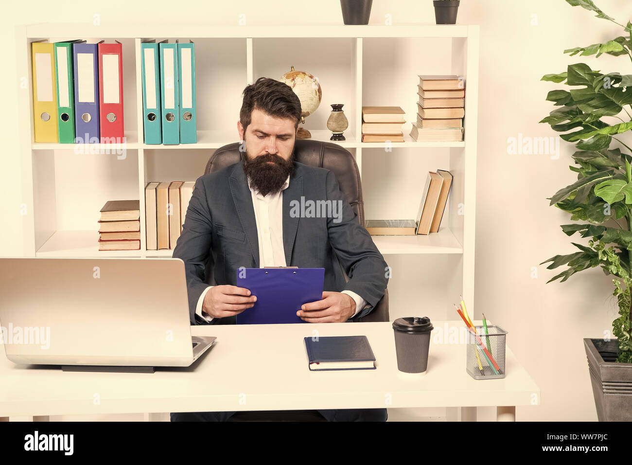 Check list. Man bearded hipster boss sit in leather armchair office ...