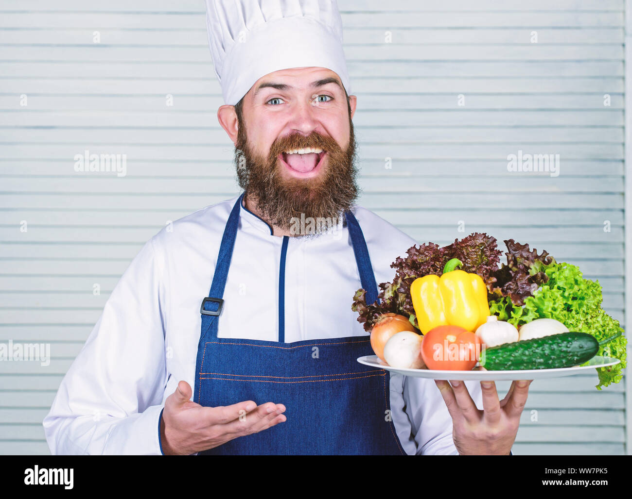 Handsome chef presenting meal hi-res stock photography and images - Alamy