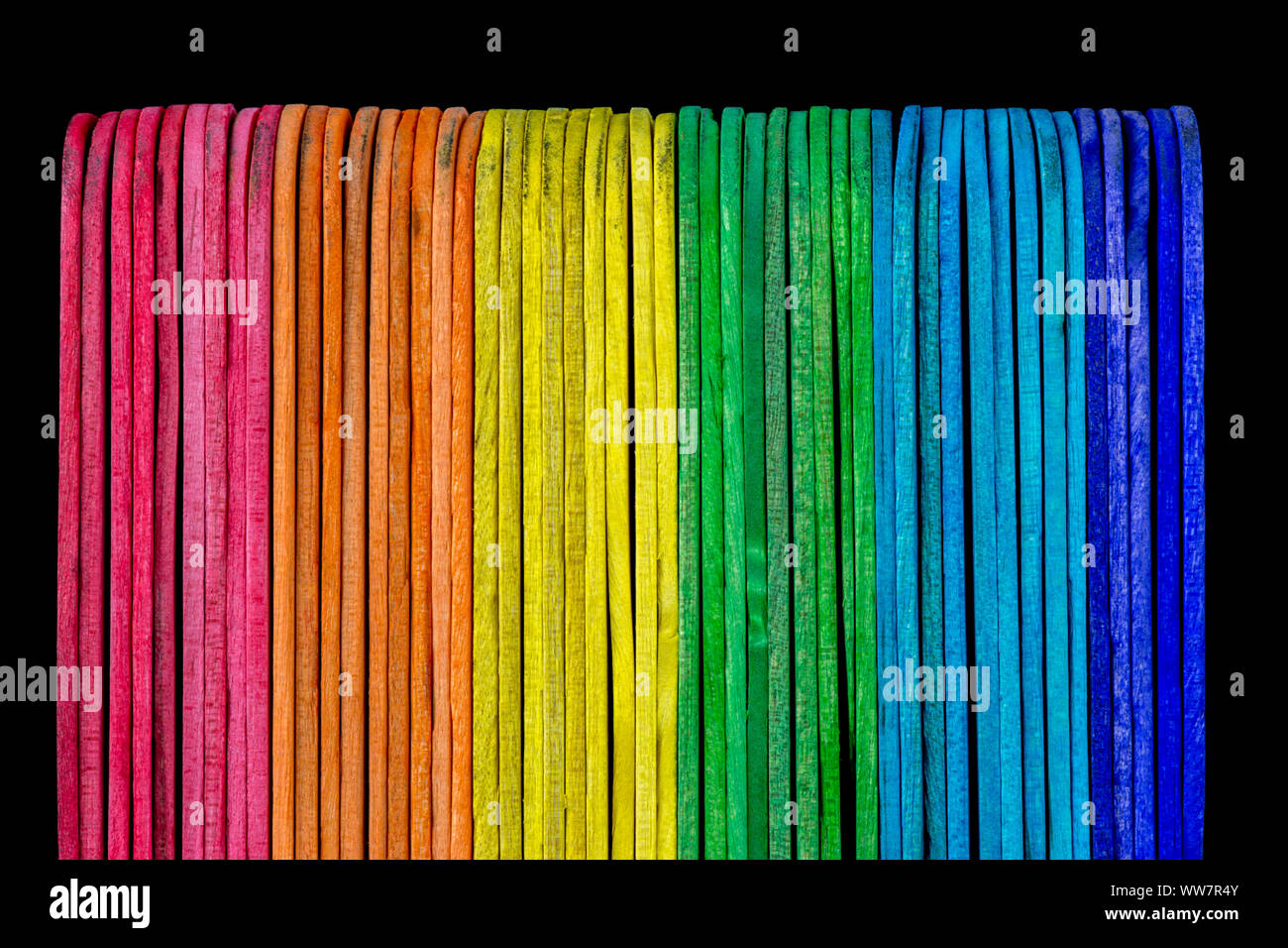 Stacked coloured sticks isolated against a black background Stock Photo ...