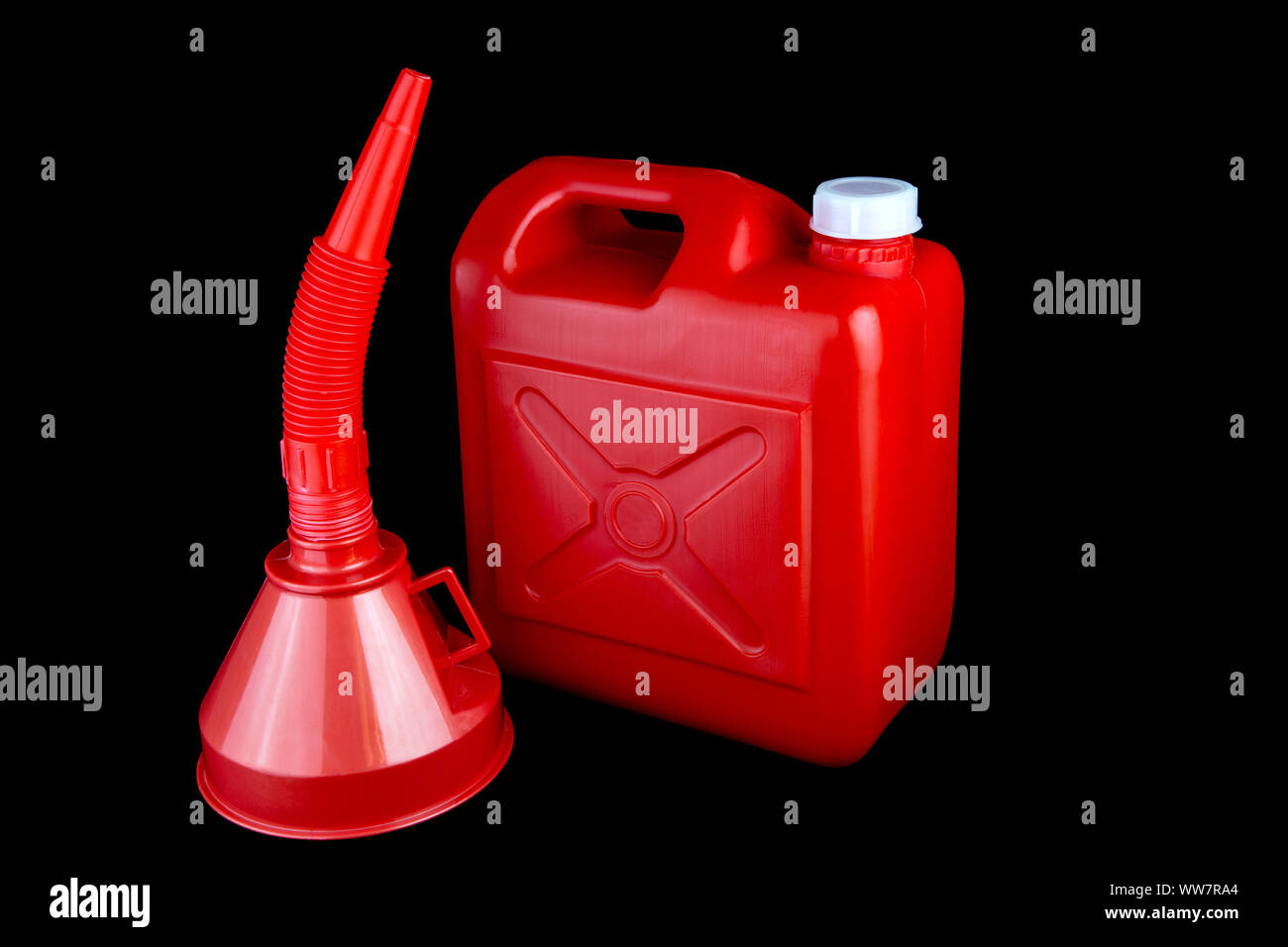Red fuel container and funnel isolated on a black background Stock ...