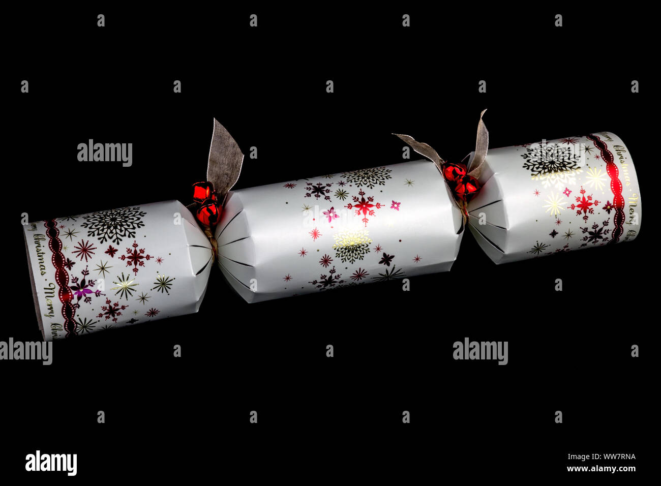 Traditional Christmas cracker isolated against a black background Stock ...