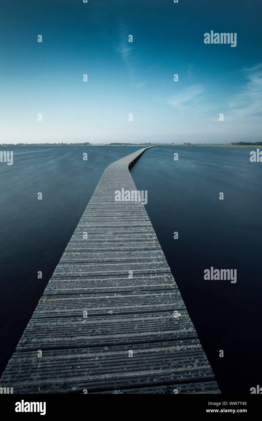 Wooden jetty over water Stock Photo - Alamy