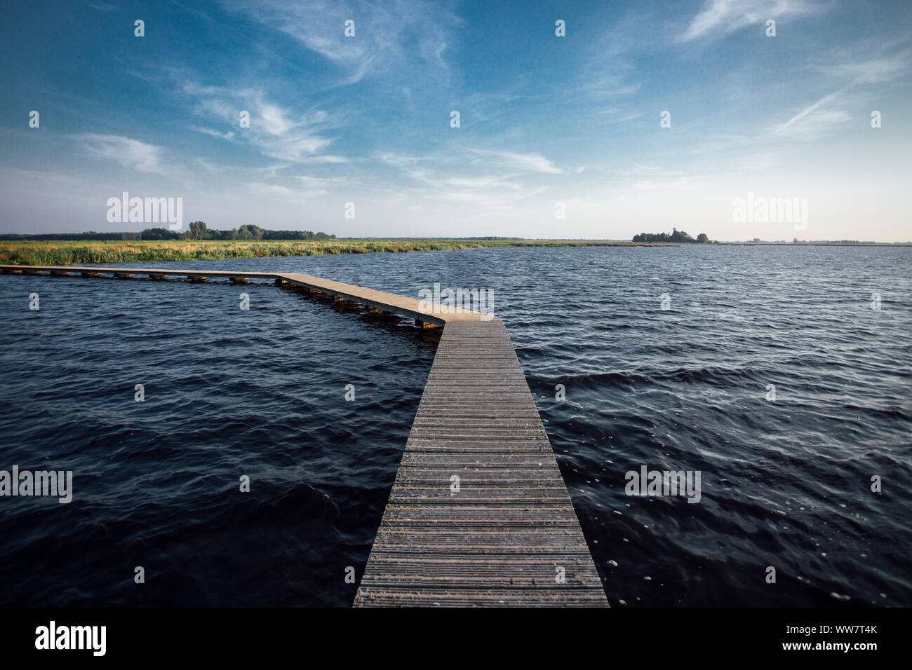 Wooden jetty over water Stock Photo - Alamy