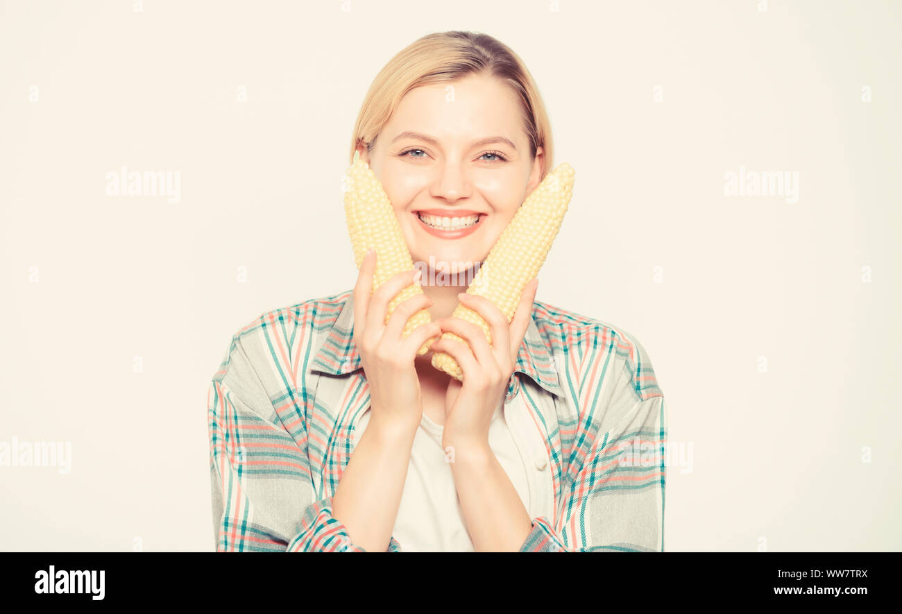 Food bring happiness. Woman hold yellow corn cob white background. Corn ...