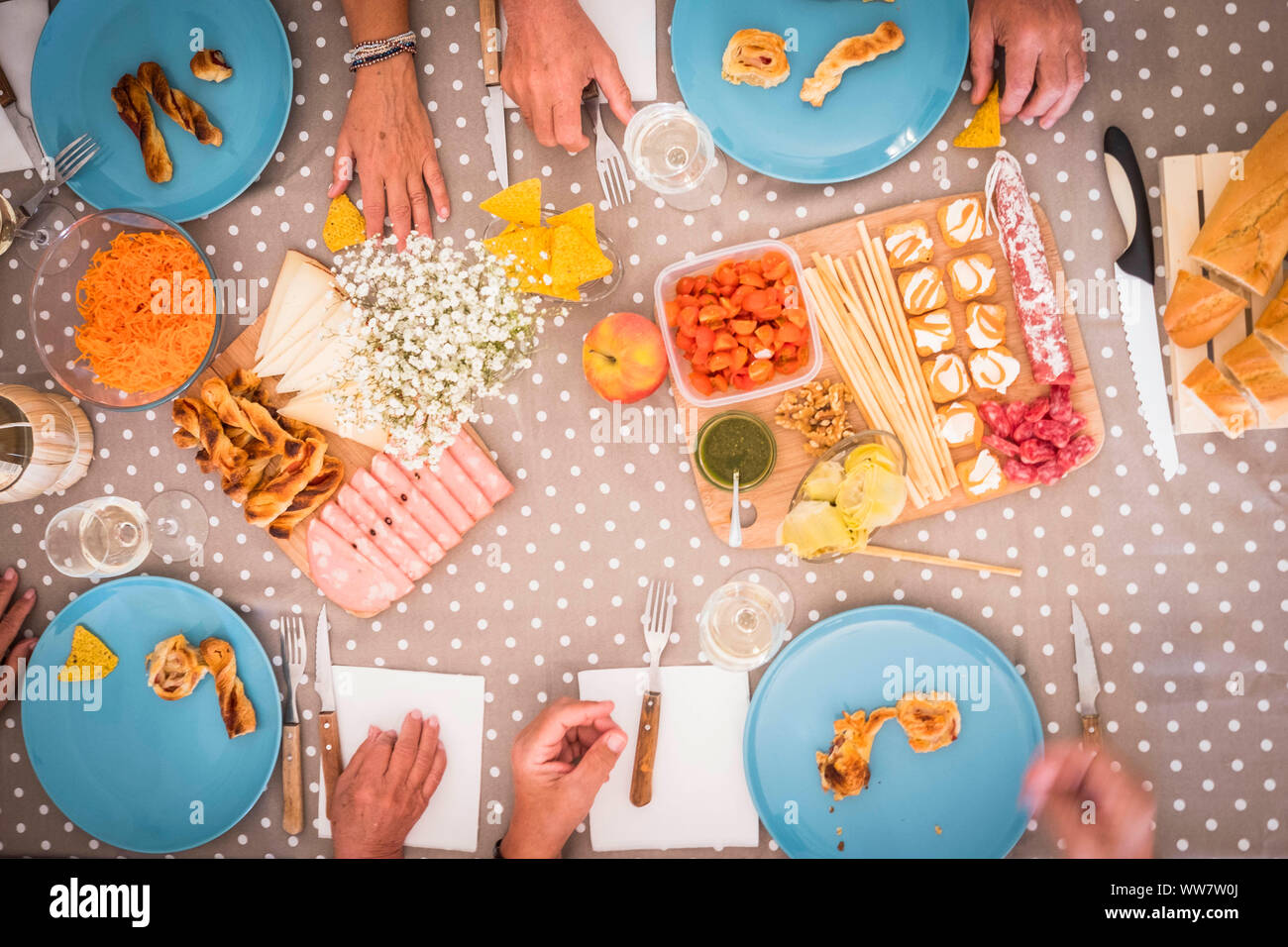 Bread and more many hands on the table waiting to eat hi-res stock ...