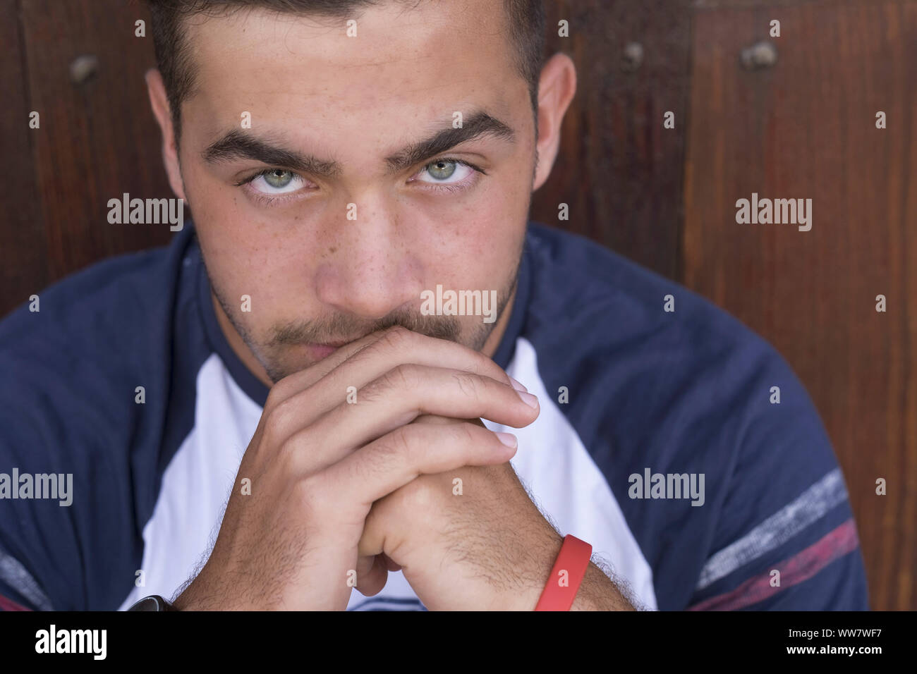 beautiful caucasian young boy looking at the camera directly and strong ...