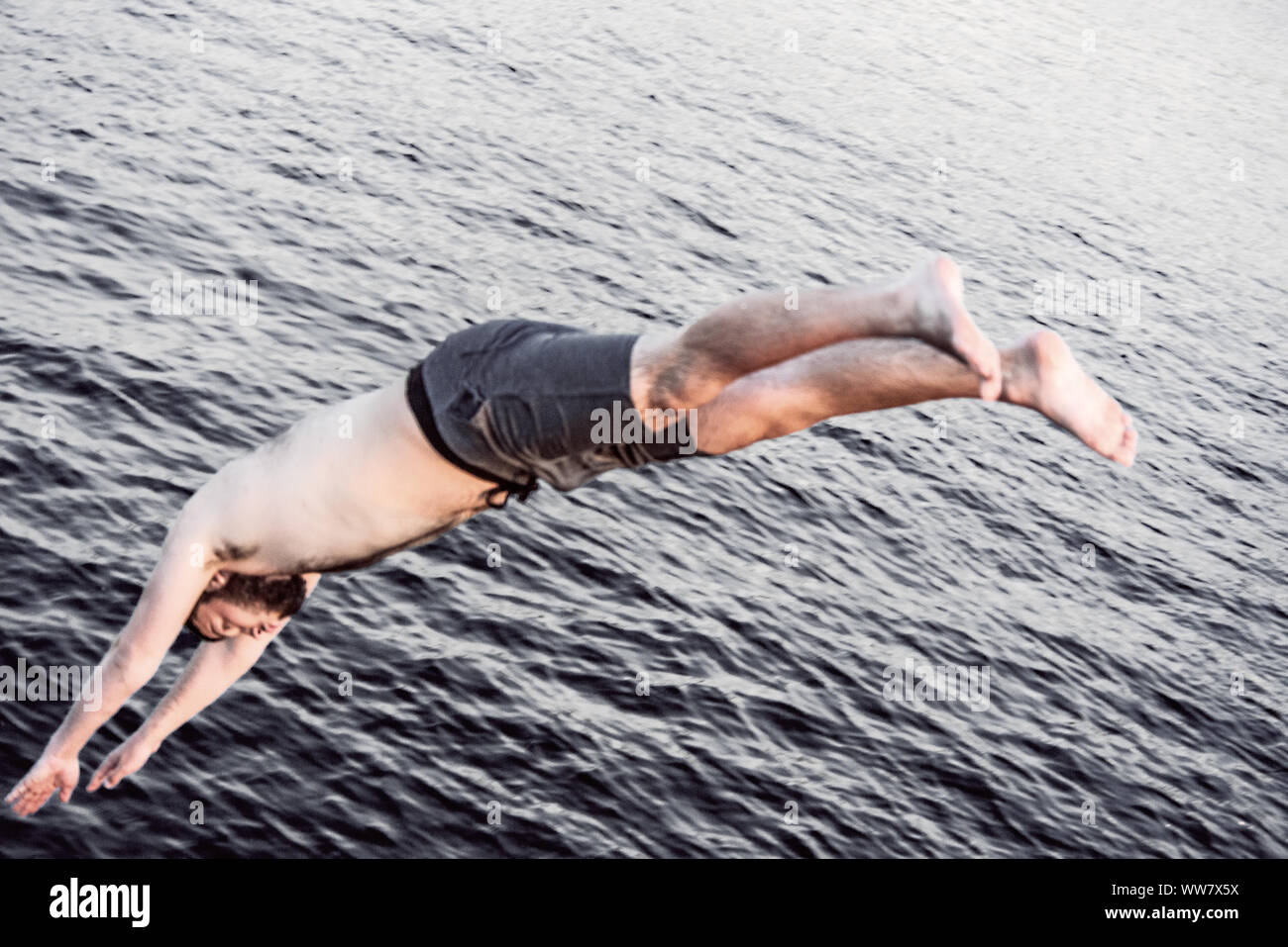 guy dives into the water Stock Photo - Alamy