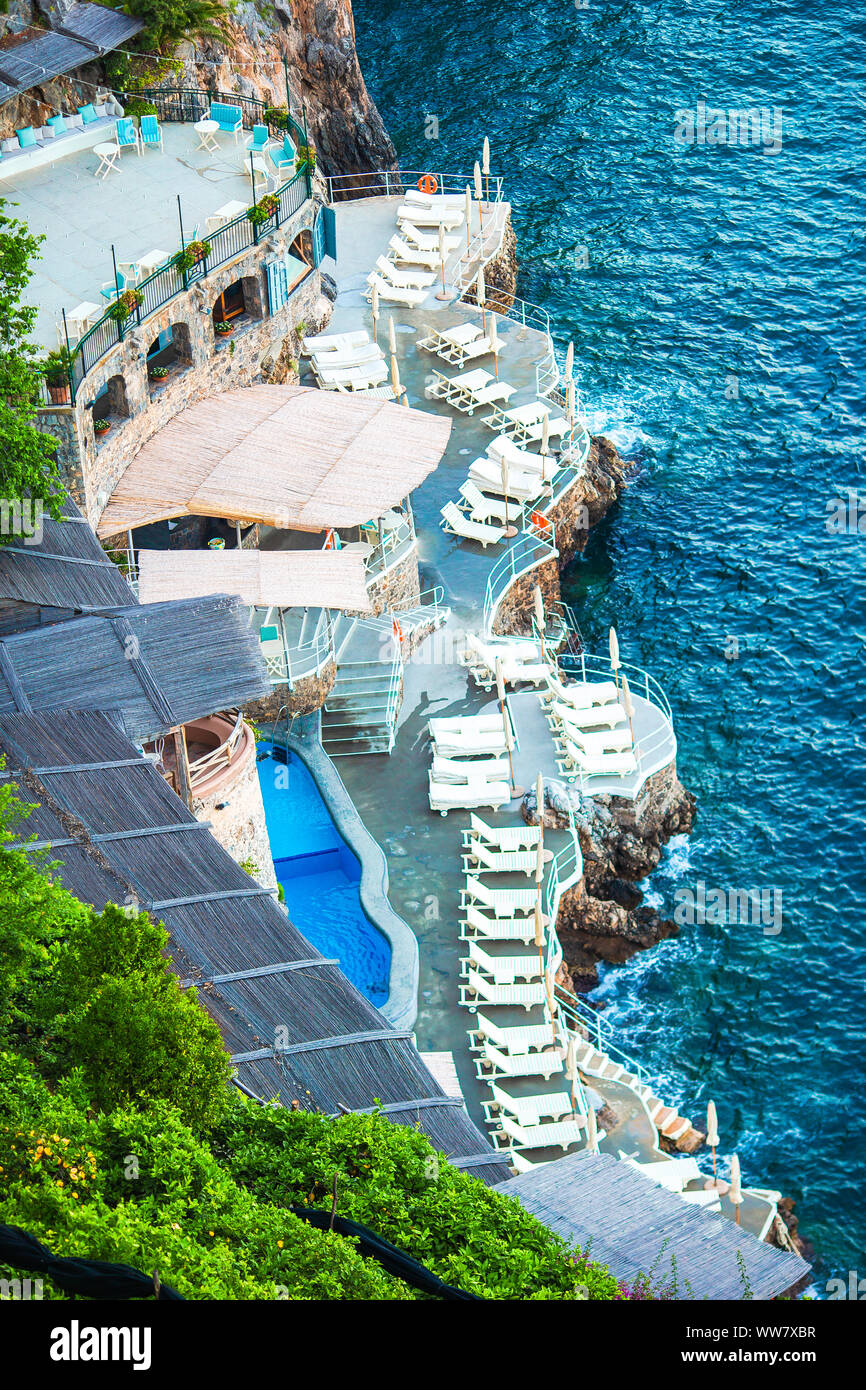 Beautiful cozy bay with small houses on the hill and clear turquoise ...