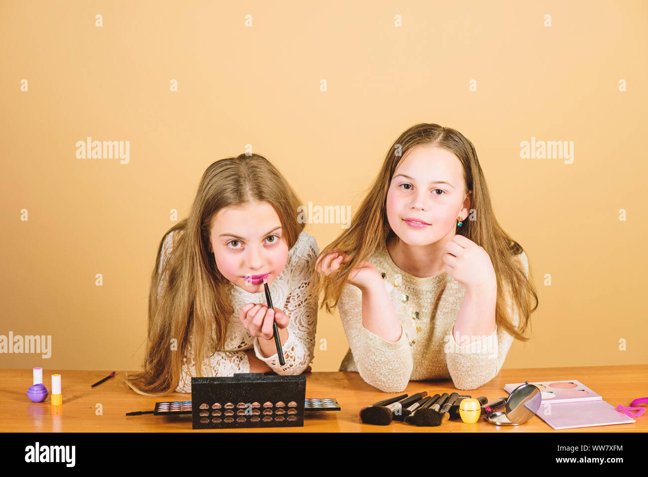 Artists helping to look good. Adorable beauty artists doing makeup ...