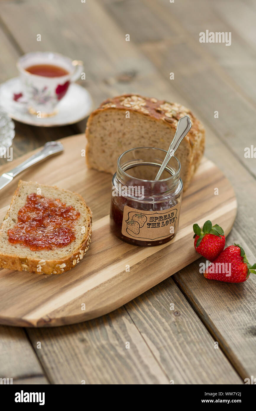Strawberry jam, preserving jar, serving tray Stock Photo - Alamy