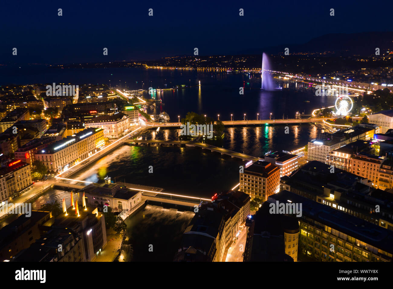 Aerial night view of Geneva city waterfront skyline in Switzerland ...
