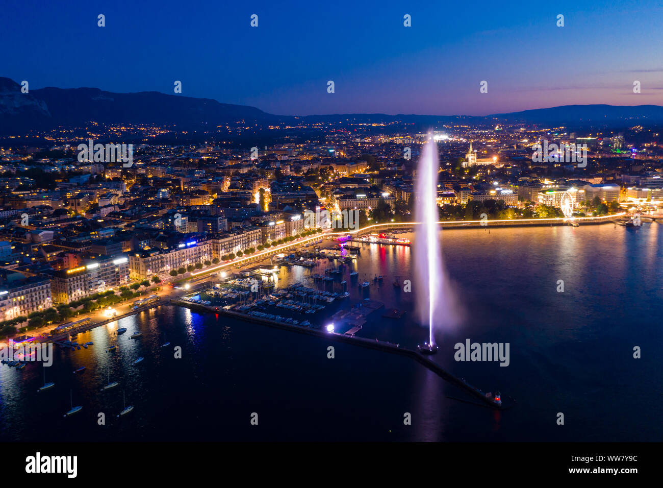 Aerial night view of Geneva city waterfront skyline in Switzerland ...