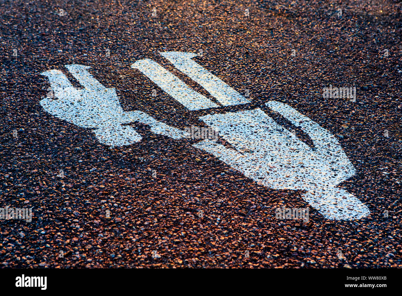 Pedestrian symbol painted on sidewalk Stock Photo - Alamy