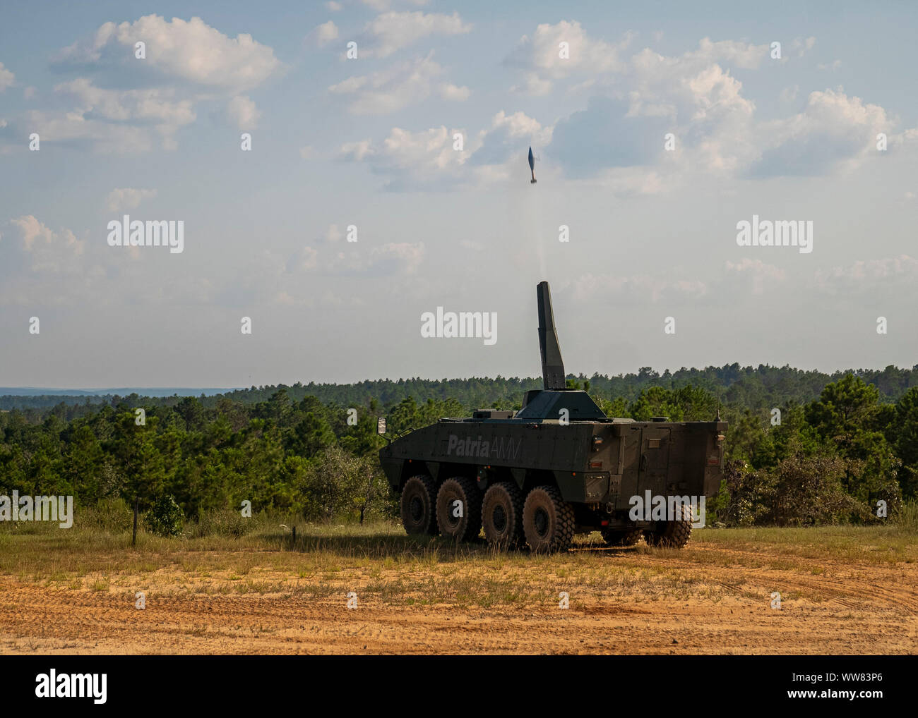 FORT BENNING, Ga. -- Spectators gather to watch the Patria Nemo 120-mm ...