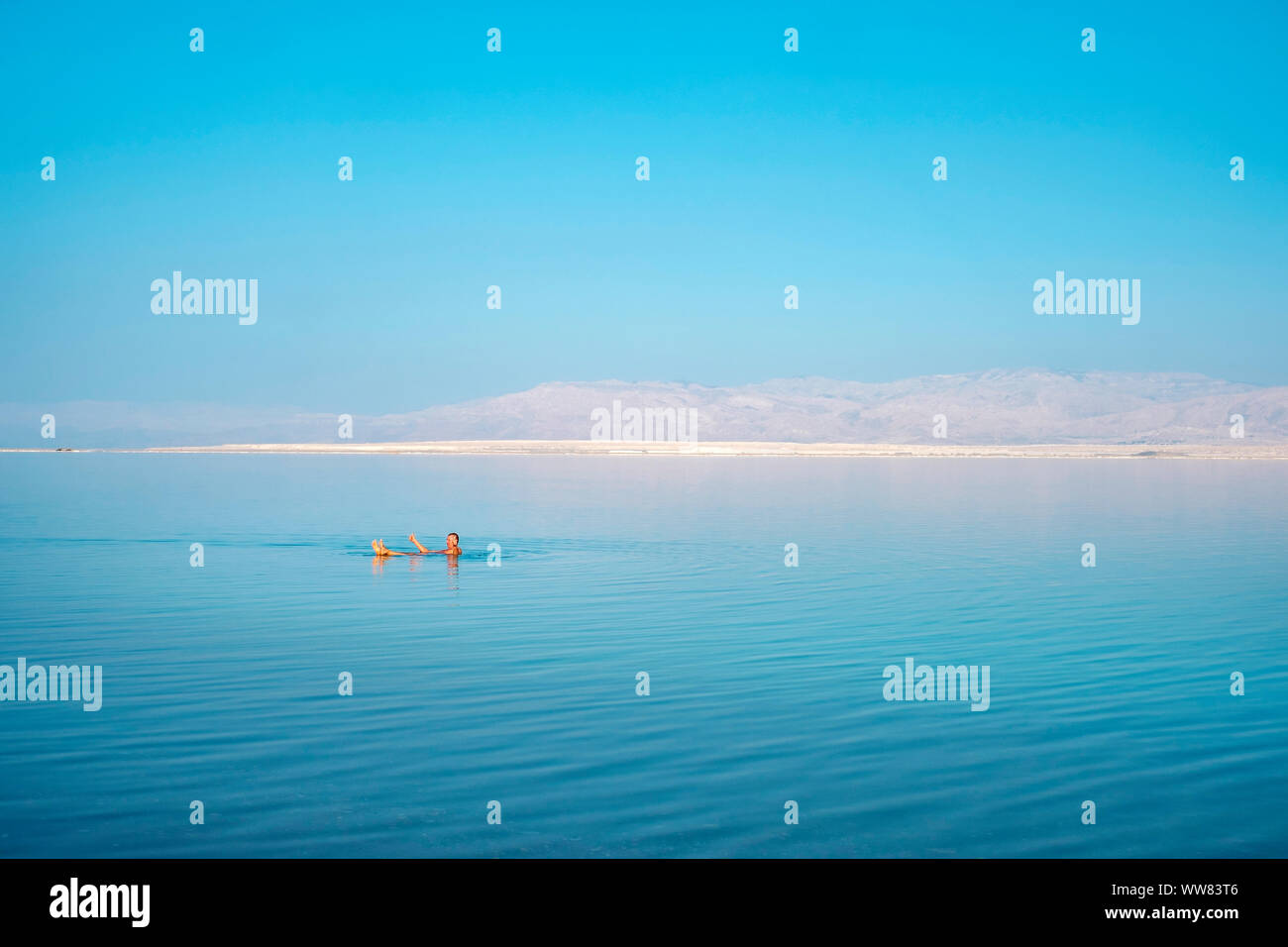 Dead sea man floating at the dead sea hi-res stock photography and ...