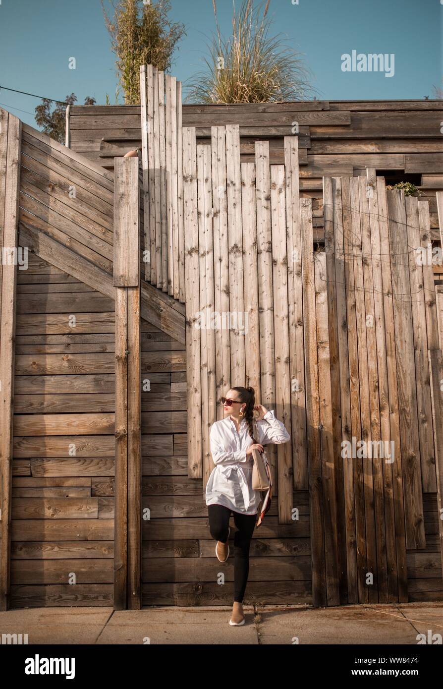 Woman standing on pavement hi-res stock photography and images - Alamy