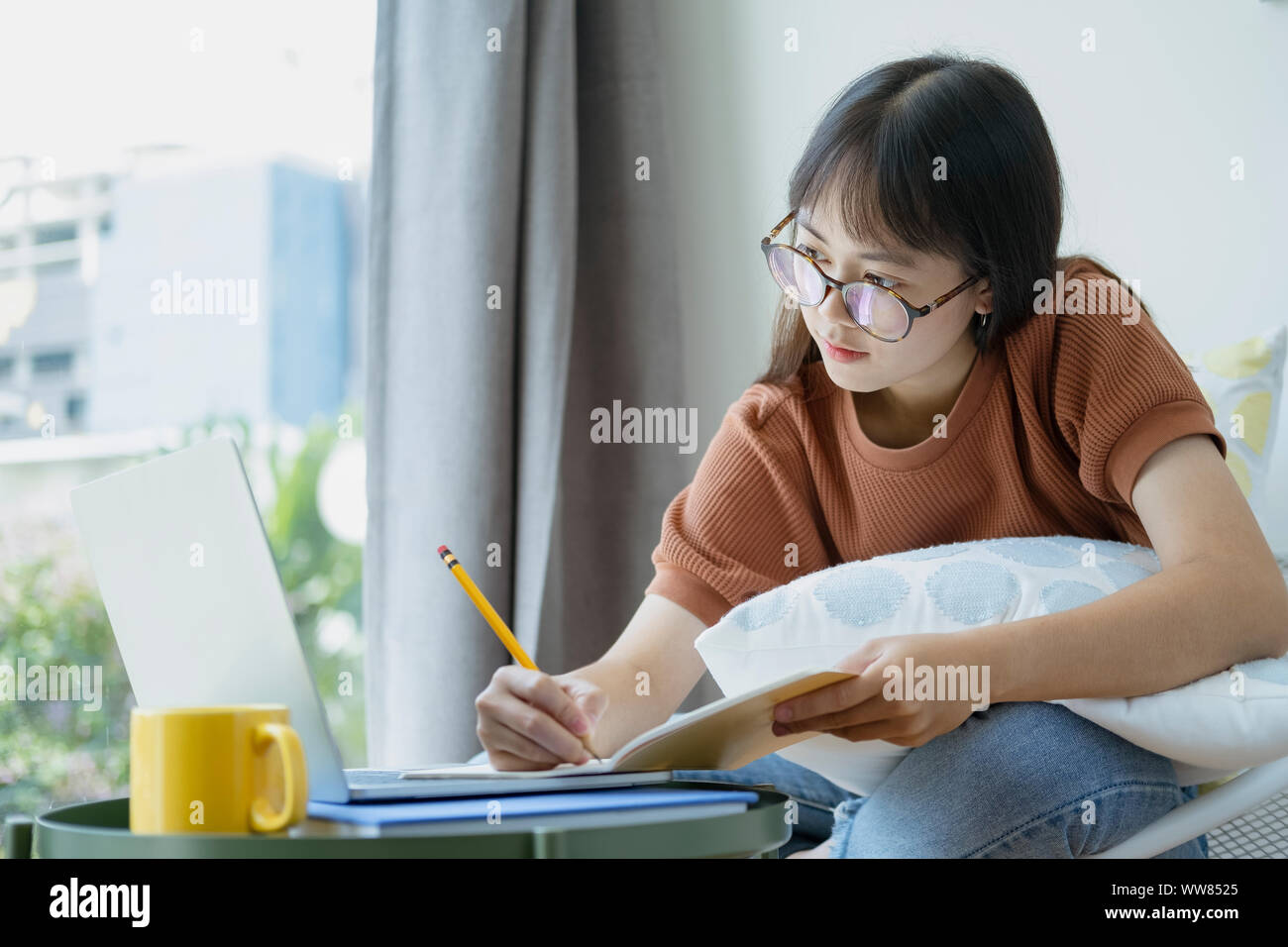 Collage student female reading and researching form book. Education and ...