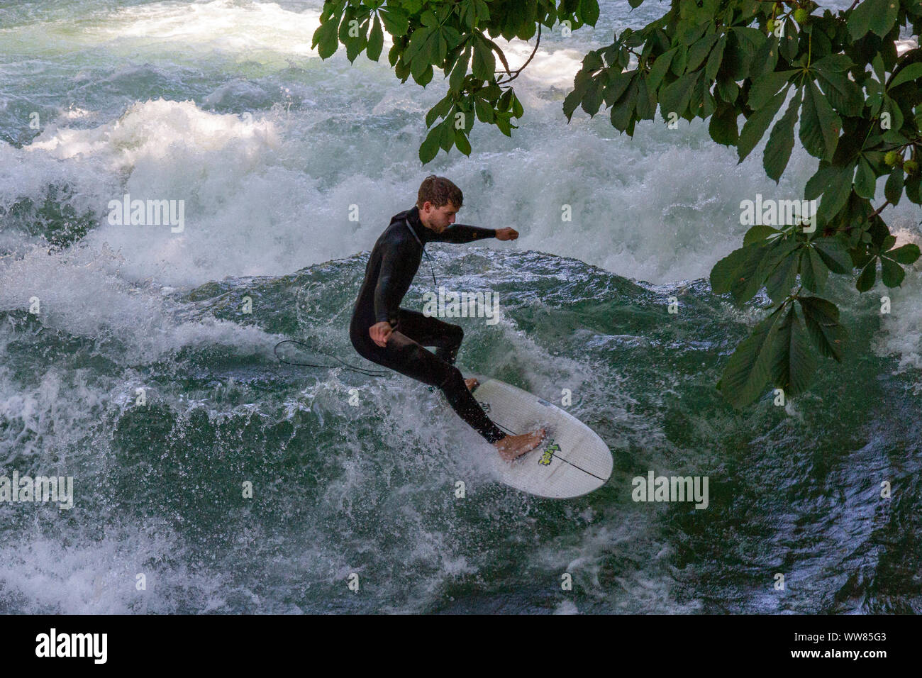 River Wave surfing on the Eisbach, which flows through Englischer ...