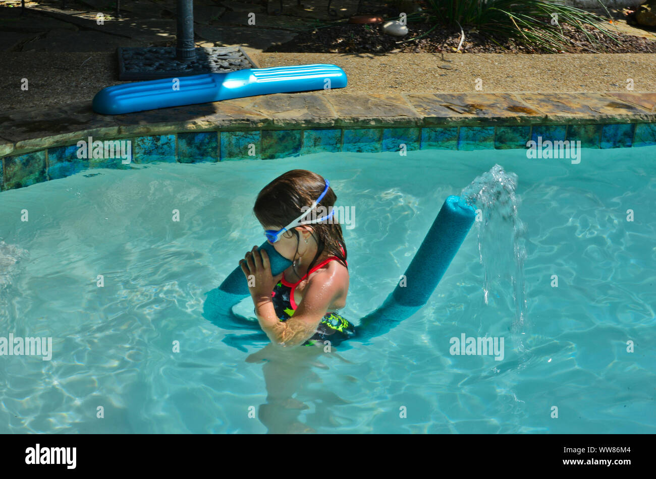 Children playing and in the swimming pool Stock Photo - Alamy