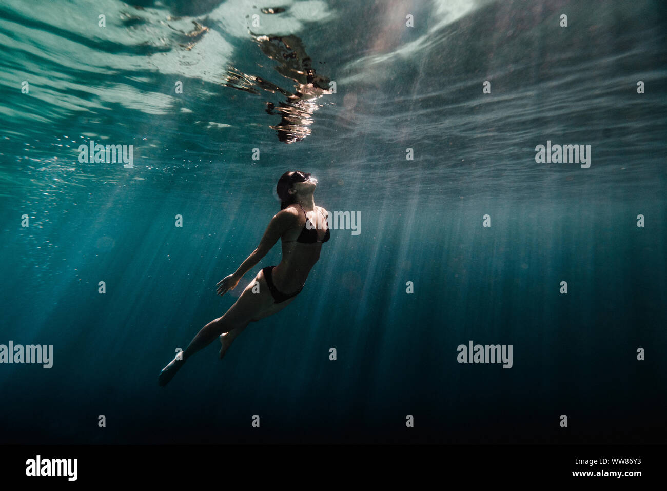 Woman swimming in snorkel fins hi-res stock photography and images - Alamy