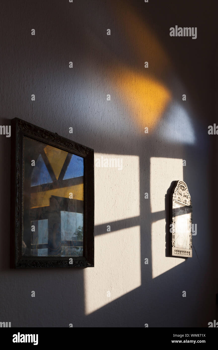 Incidence of light throwing cross shadow on church wall Stock Photo - Alamy