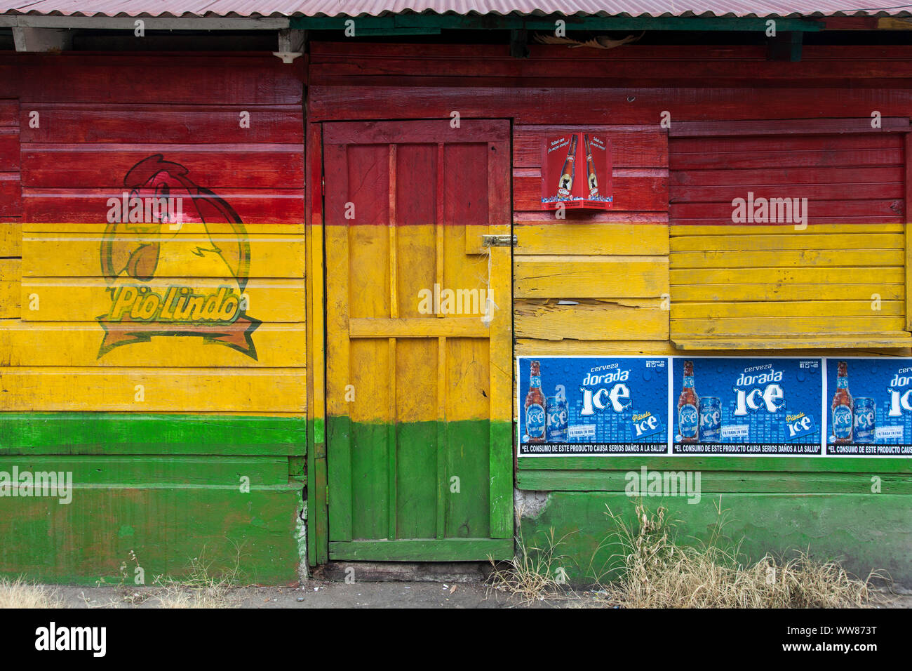 Red yellow green coat of paint at wooden hut hi-res stock photography ...