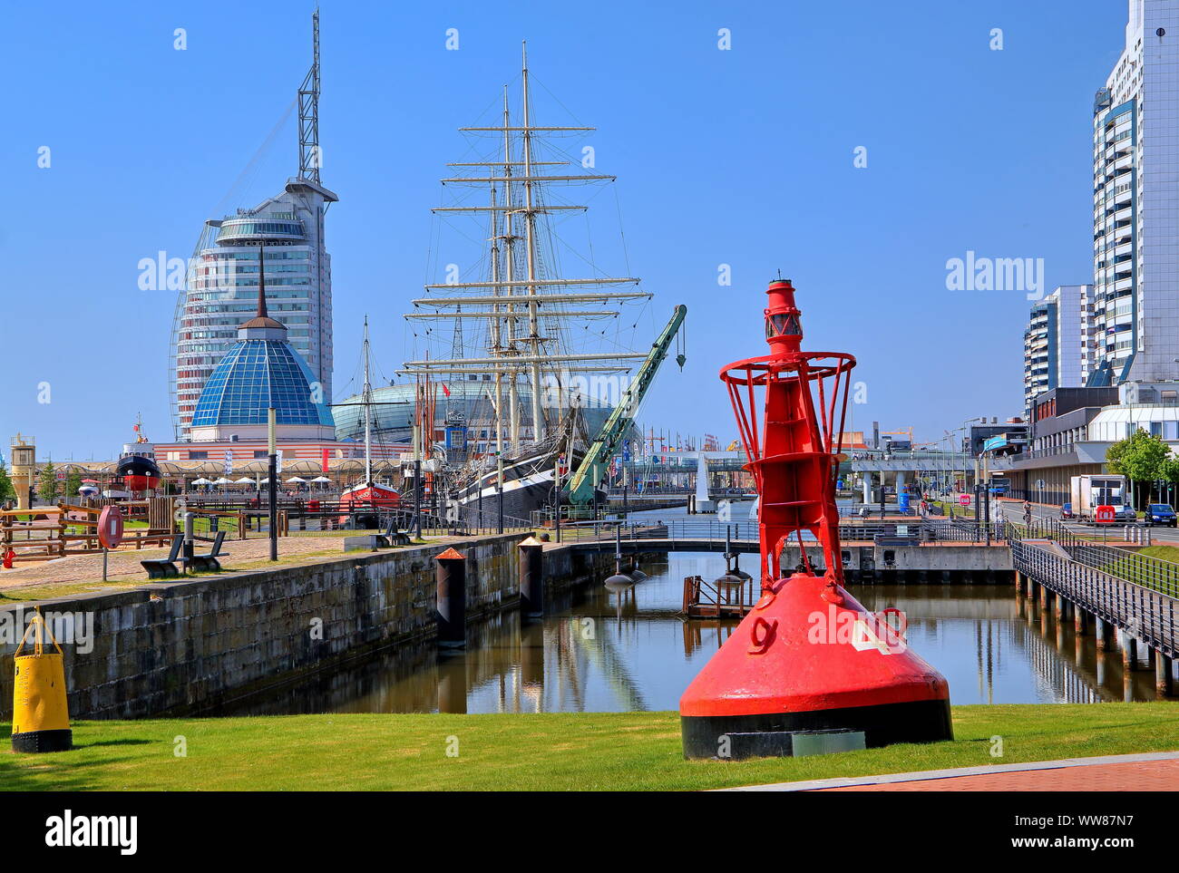 Seamark, red buoy at the old harbour with sailing ship Seute Deern ...
