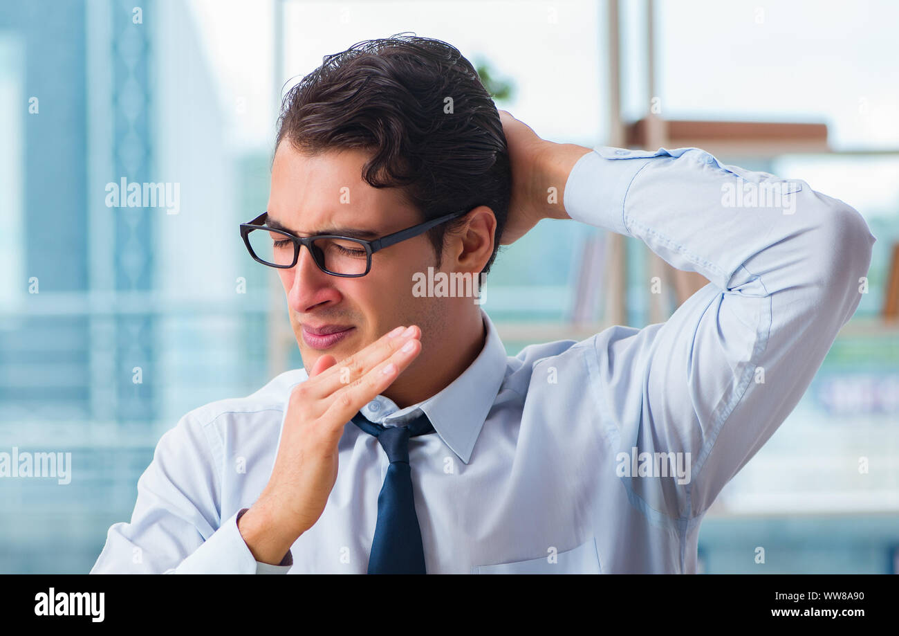 The businessman suffering from excessive armpit sweating Stock Photo ...