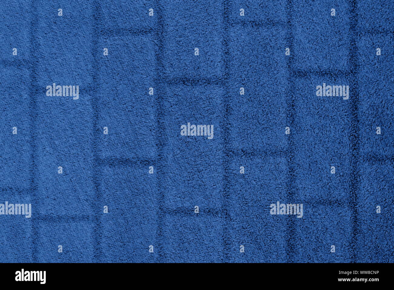 Blue grass background with a brick wall texture. Color of summer 2019 ...