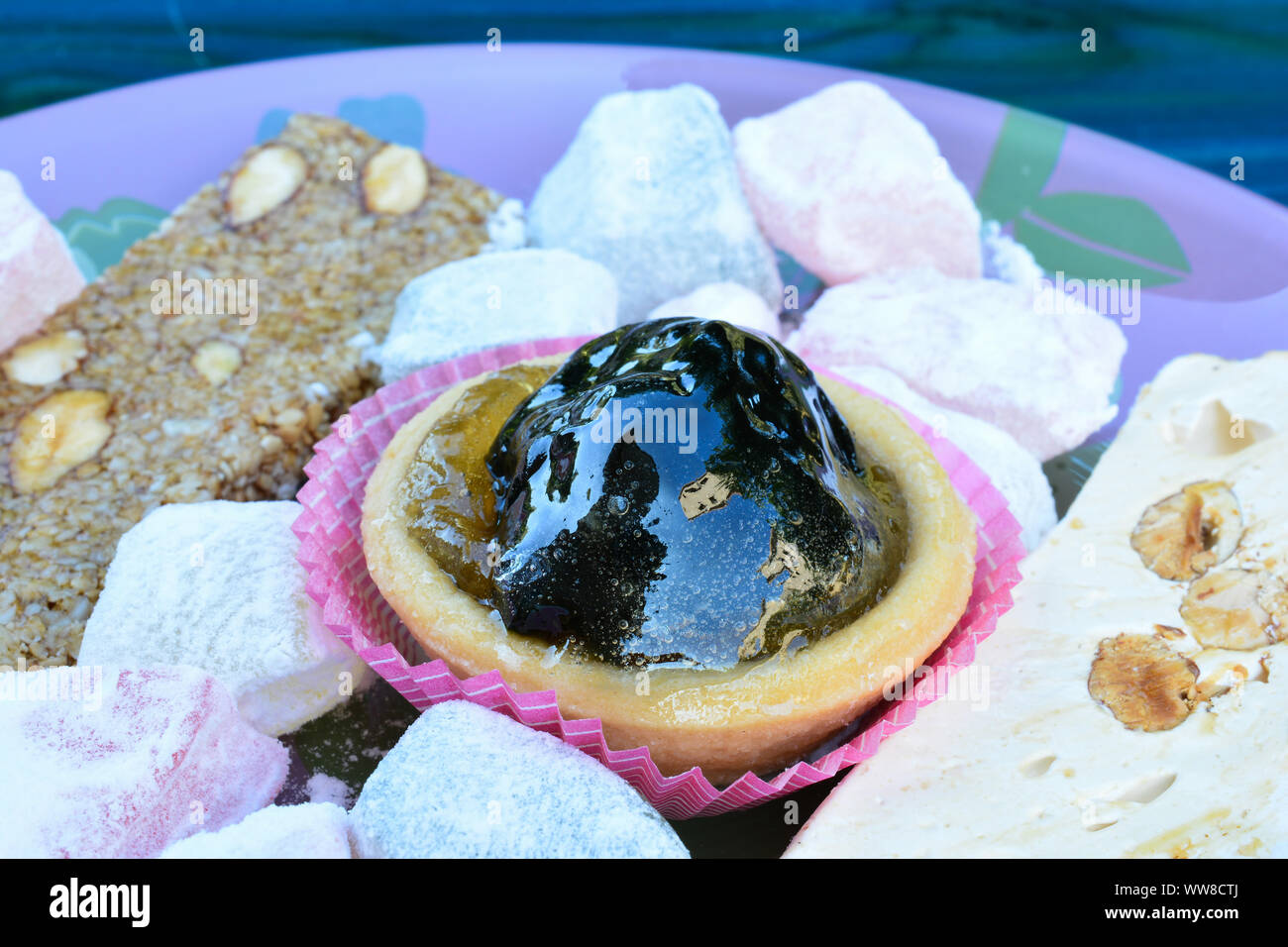 Candied walnut in punnet of dough served with Turkish delight and and ...
